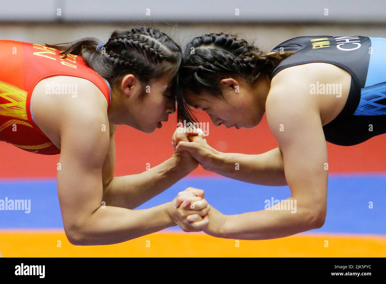 Bucharest, Romania. 30th July, 2022. Feng Ziqi (L) of China competes ...
