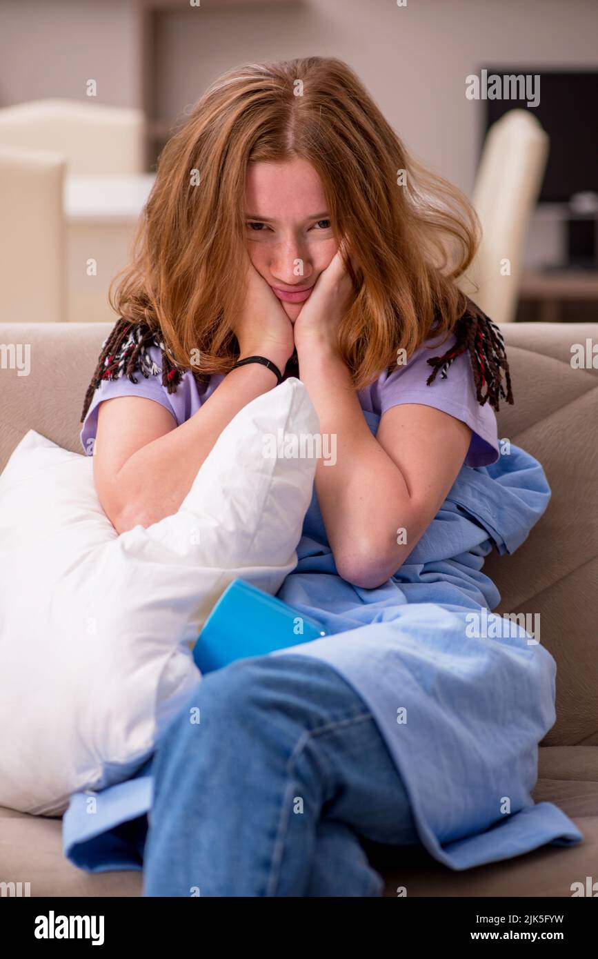 Young woman feeling bad at home Stock Photo - Alamy