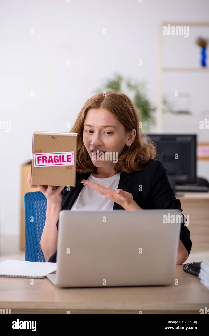 Woman delivering fragile box in hi-res stock photography and images - Alamy