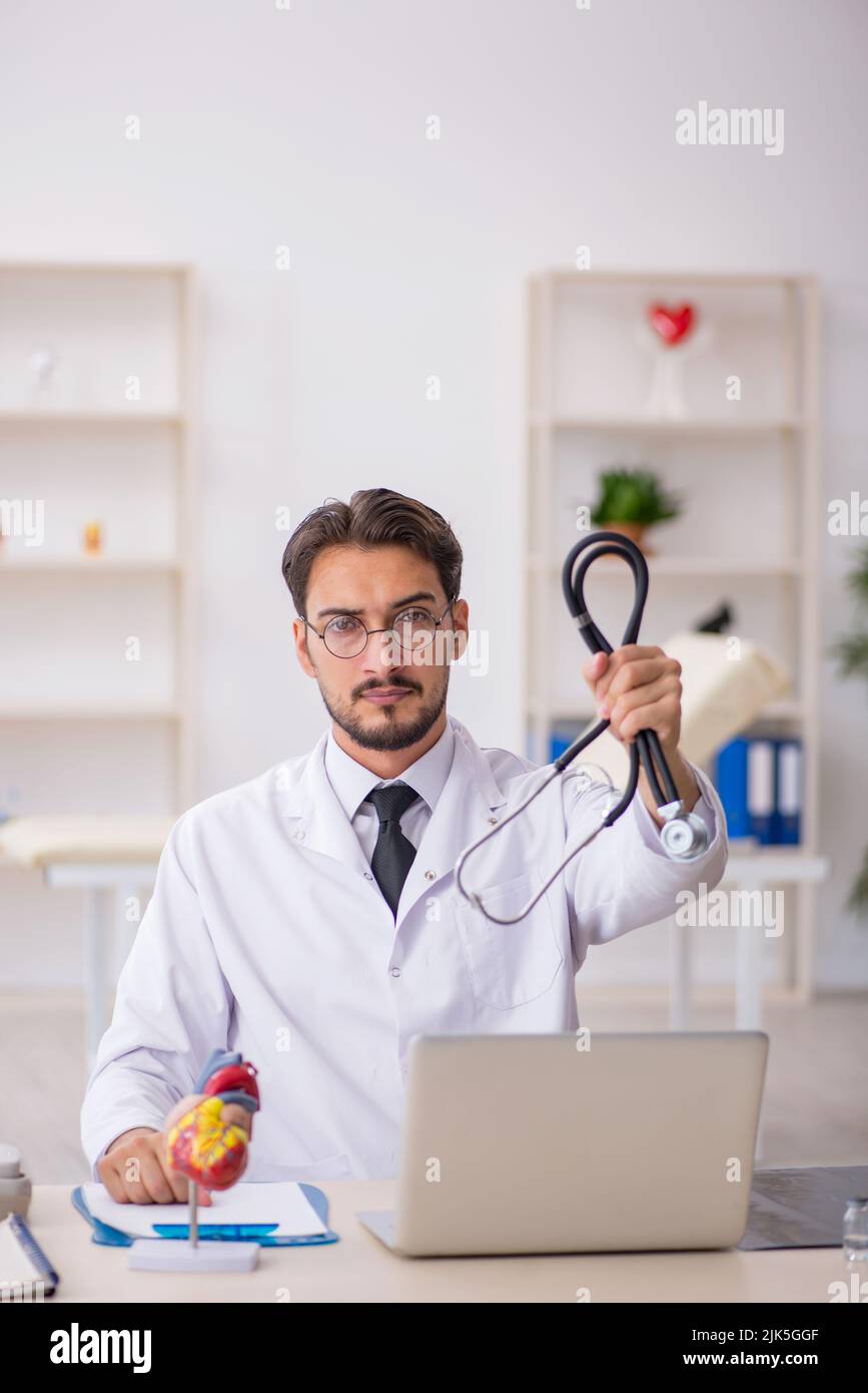 Young doctor cardiologist working at the hospital Stock Photo - Alamy