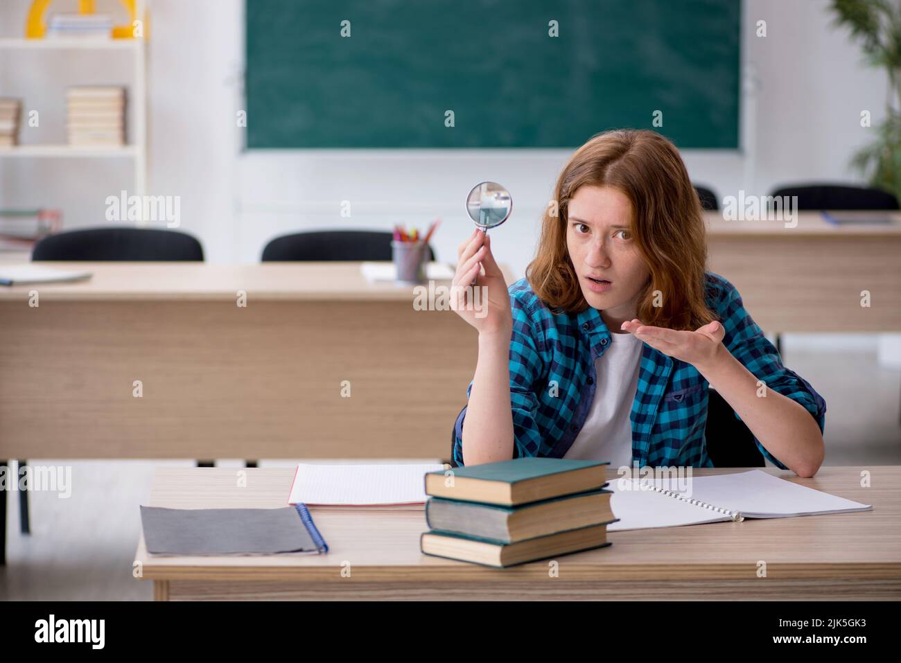 Female student preparing for exams in the classroom Stock Photo - Alamy