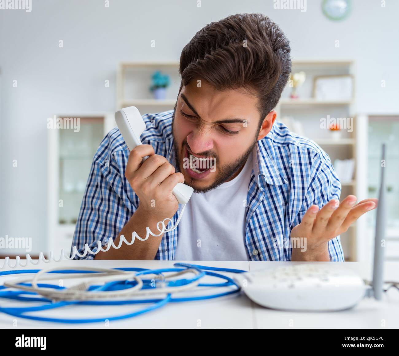 The frustrated young man due to weak internet reception Stock Photo - Alamy