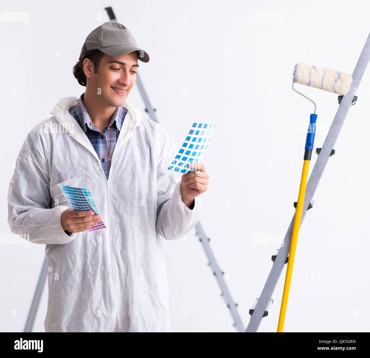 Painter working at the construction site Stock Photo - Alamy