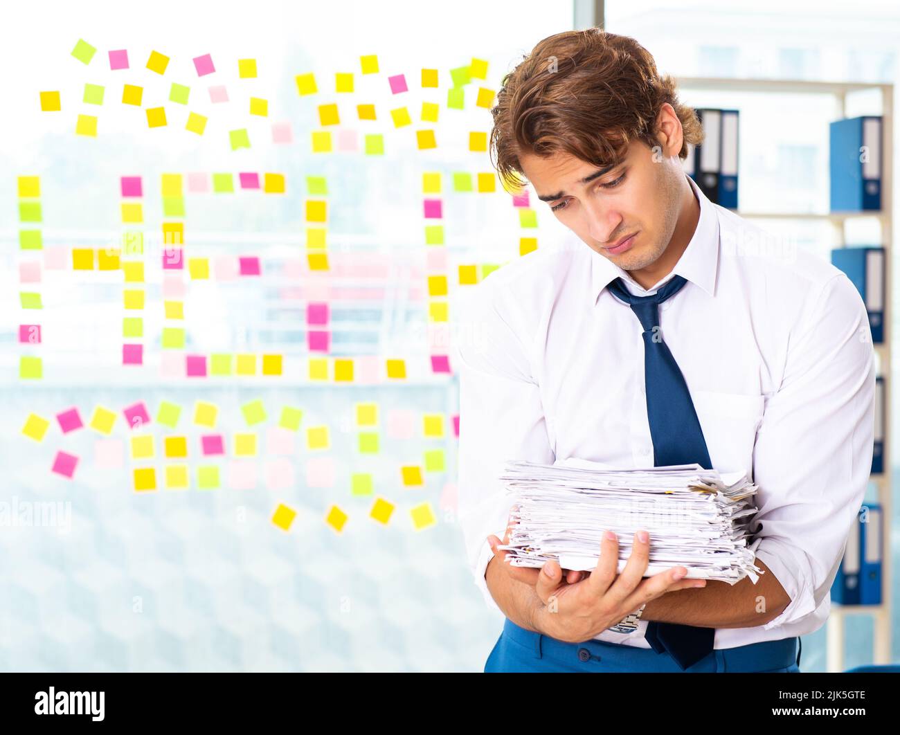 Busy businessman working in the office Stock Photo - Alamy