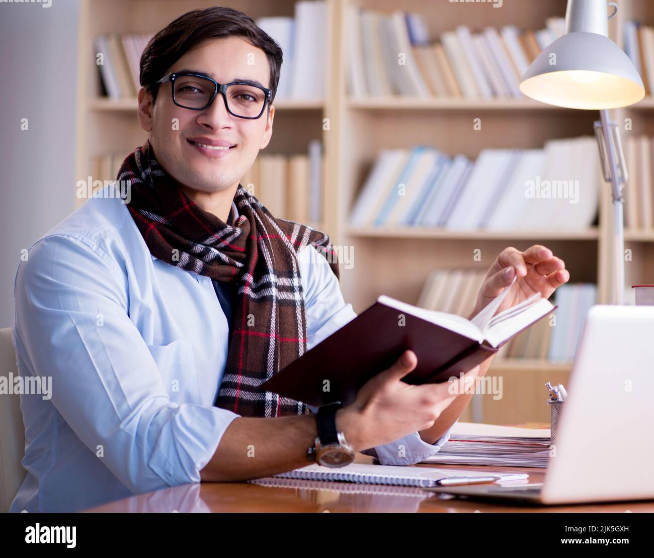 Professional journalist sitting in library hi-res stock photography and ...