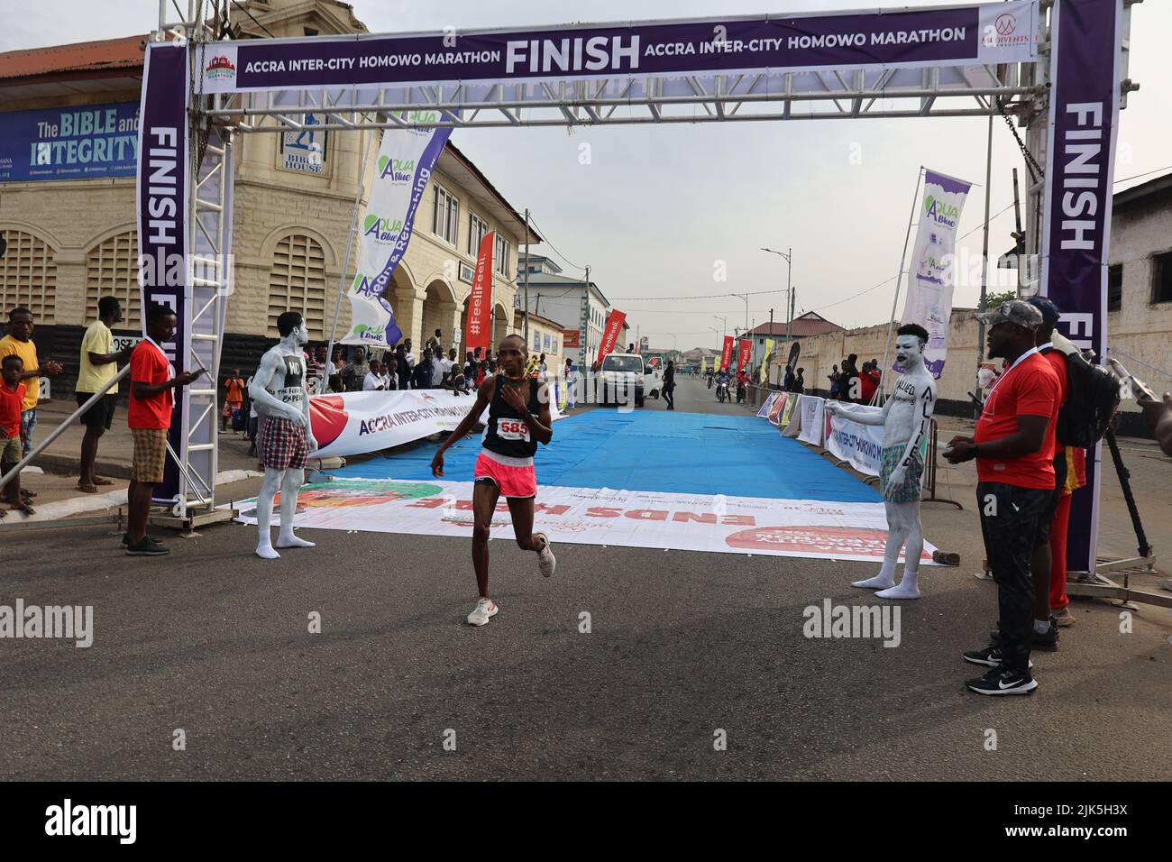 Accra, Ghana. 30th July, 2022. An athlete crosses the finish line in ...