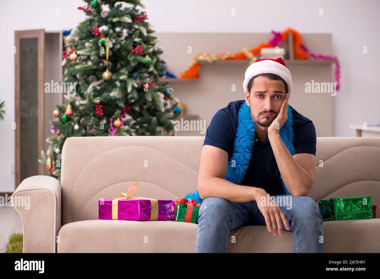 Young man celebrating New year at home alone Stock Photo - Alamy