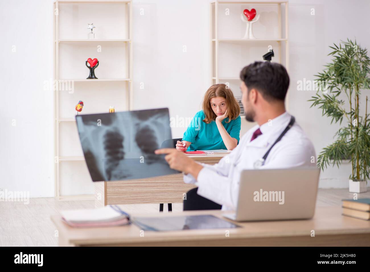 Young male doctor radiologist and female assistant working at the ...