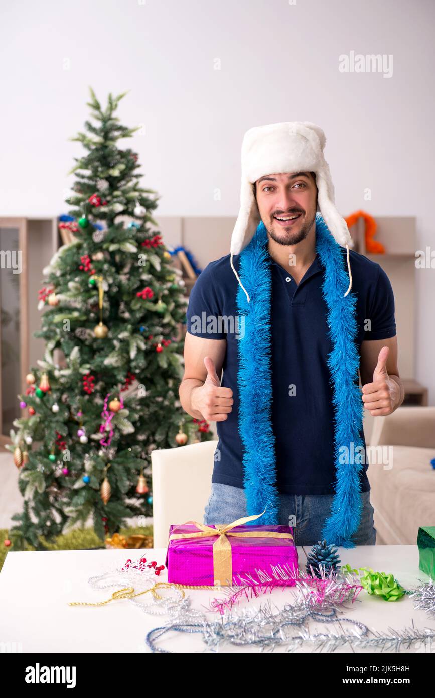 Young man celebrating New year at home alone Stock Photo - Alamy