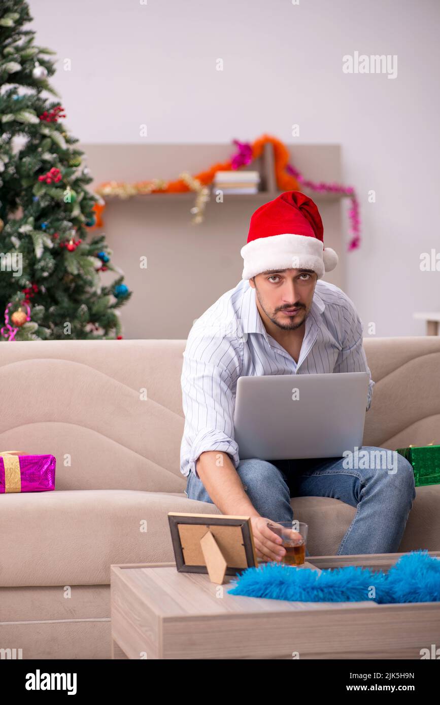 Young man celebrating New year at home alone Stock Photo - Alamy
