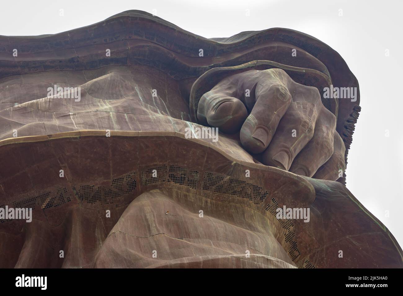 hand fingers of statue of unity with bright dramatic sky at day from ...