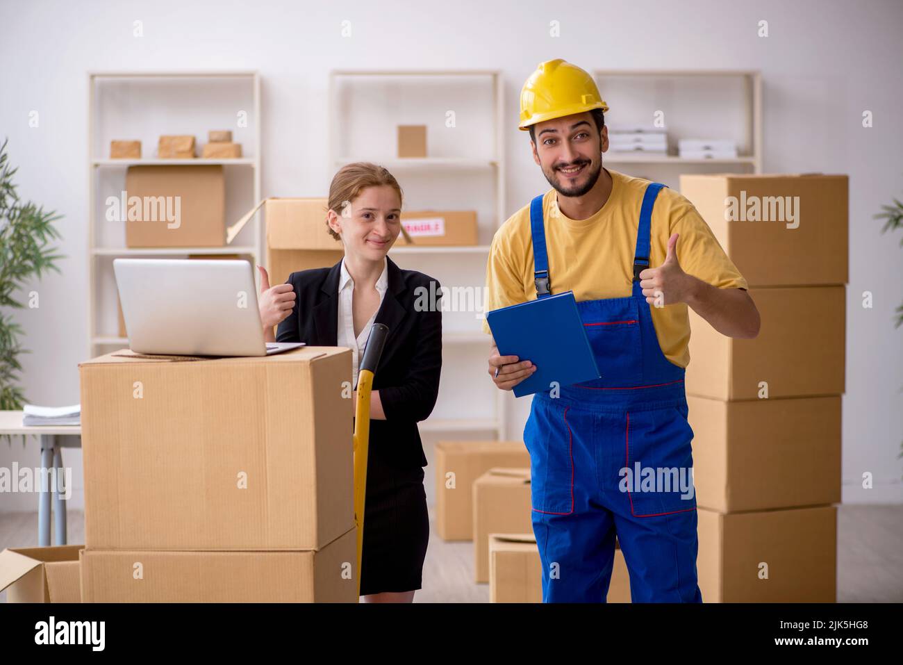 Female boss and male contractor doing home relocation Stock Photo - Alamy