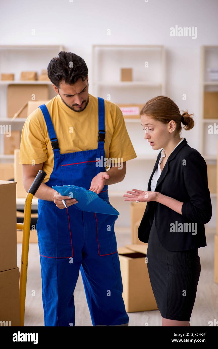 Female boss and male contractor doing home relocation Stock Photo - Alamy