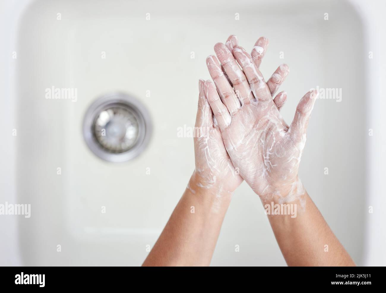 Healthy hands are happy hands. an unrecognizable person washing their ...