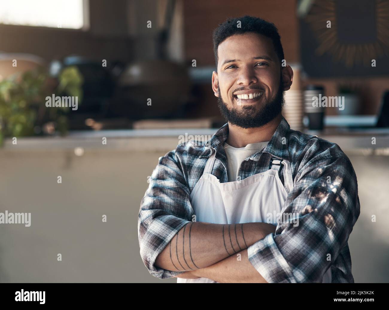 Im a proud owner of a restaurant. a handsome young man standing outside ...