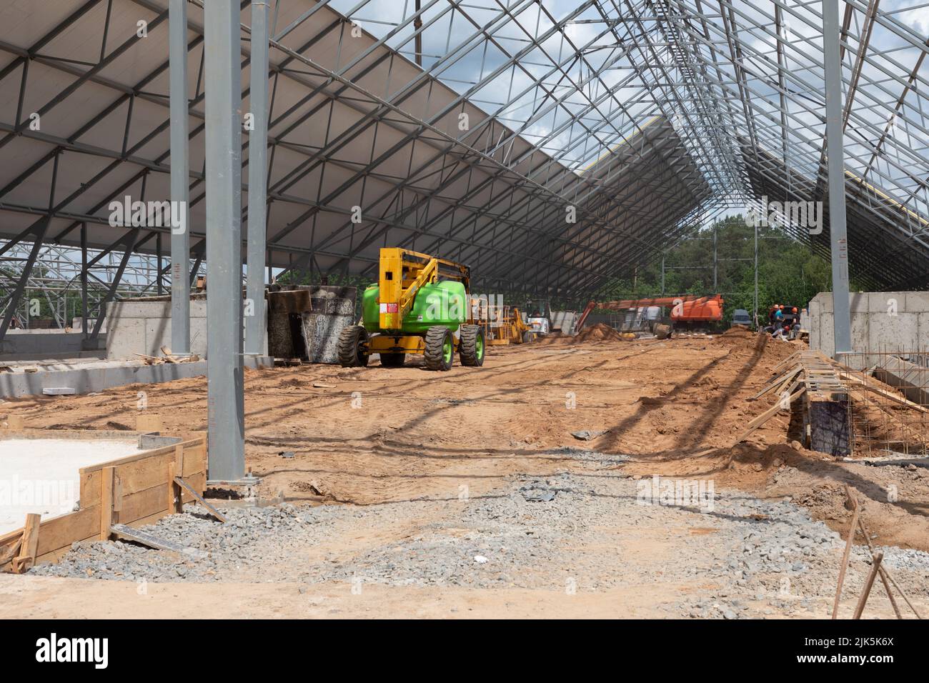 construction machinery at the construction site where a modern dairy ...