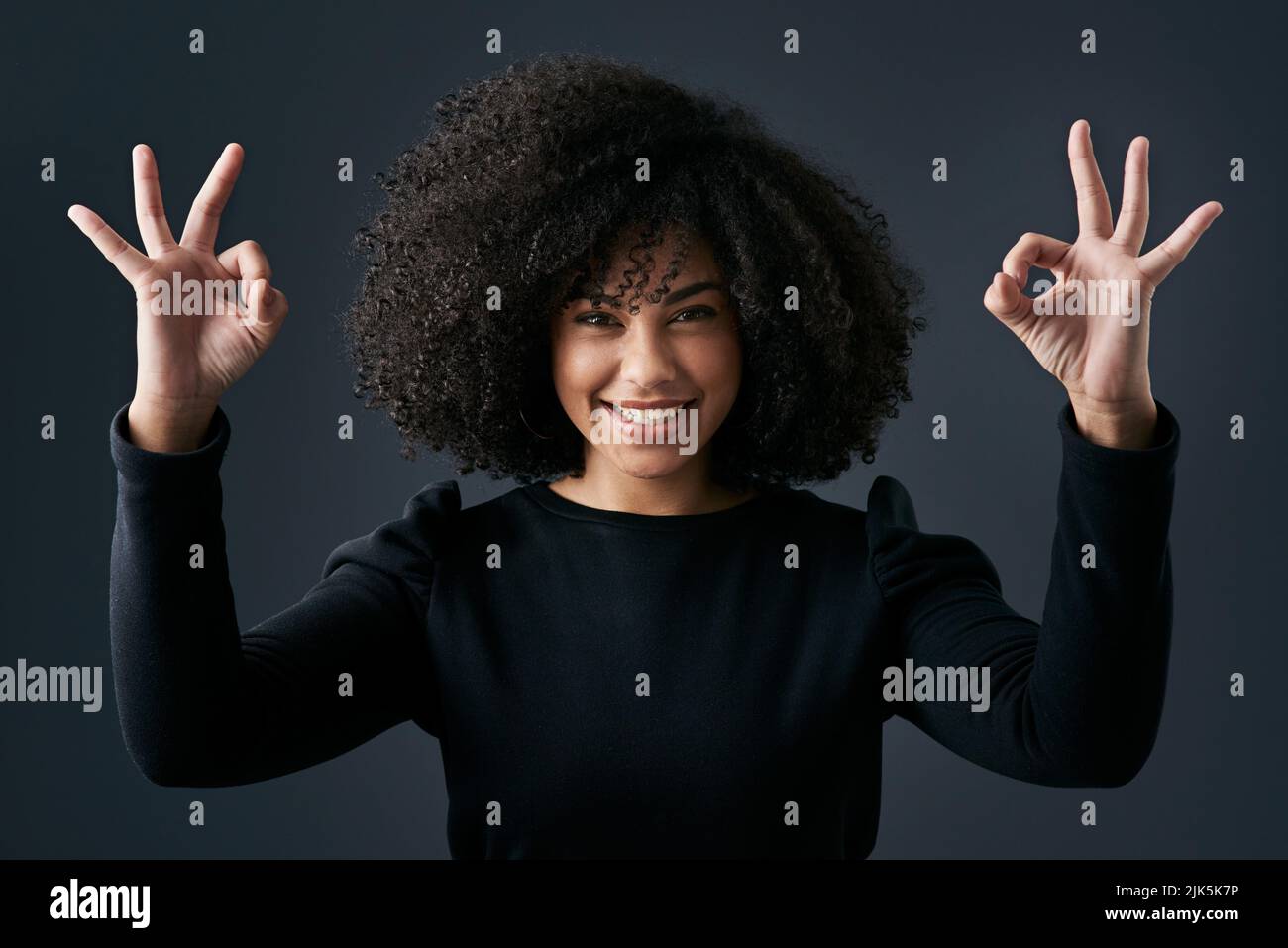 Find your happy place. a young businesswoman making hand gestures ... Find your happy place. a young businesswoman making hand gestures ...