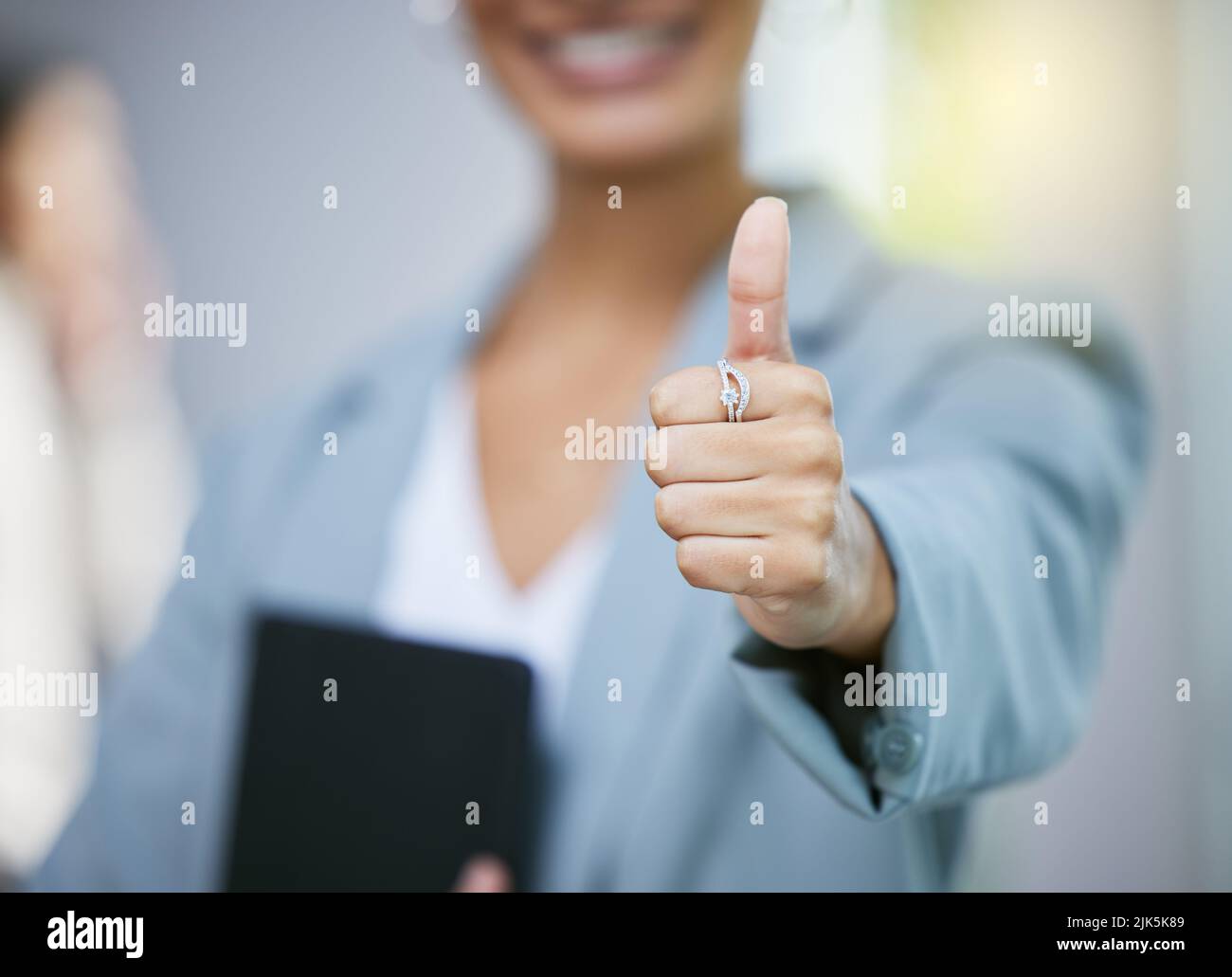 Another happy client. an unrecognizable businesswoman showing a thumbs ...