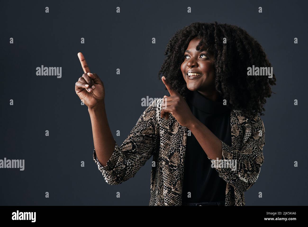 Were striving to make our way to the top. a young businesswoman against ...