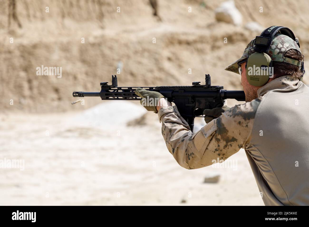 Ukrainian civilian takes part in a shooting training to learn military ...