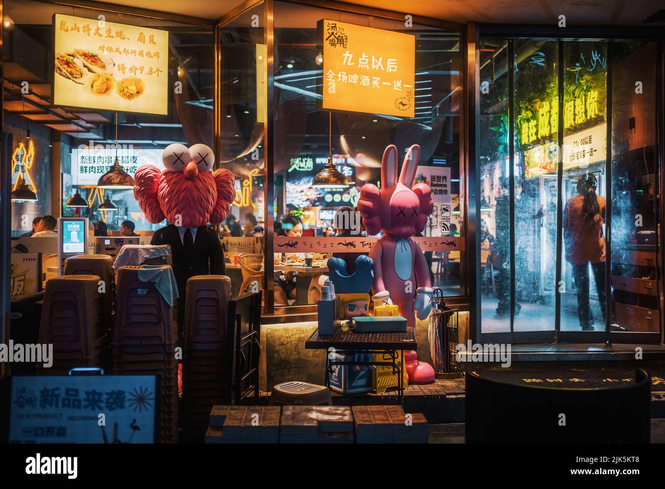 People eating in Chinese restaurants at night with neon lights Stock ...