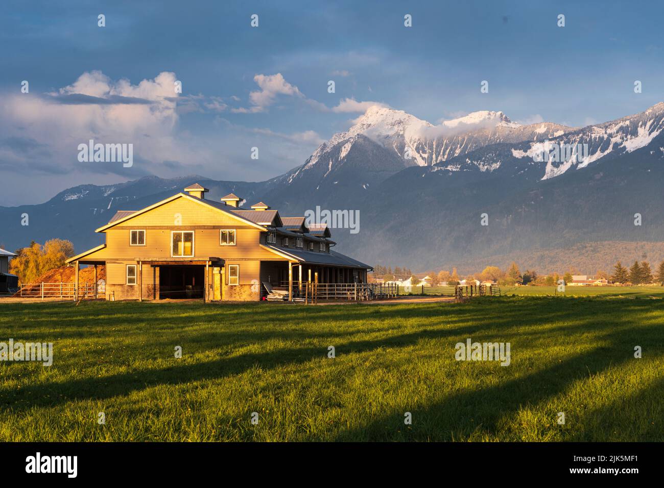 A rural farm landscape with mountains n ear Chilliwack, British ...