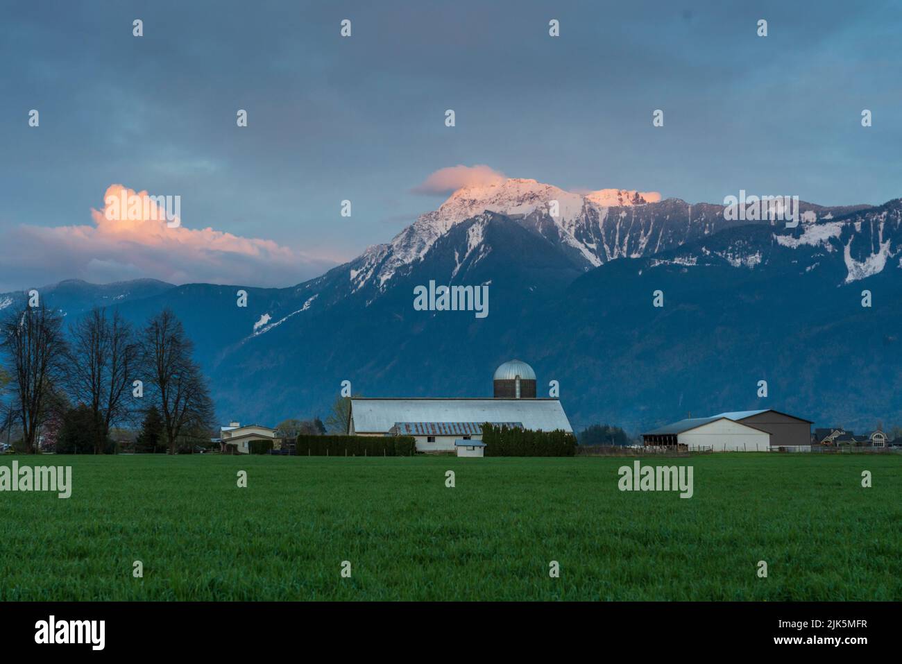 A rural farm landscape with mountains n ear Chilliwack, British ...