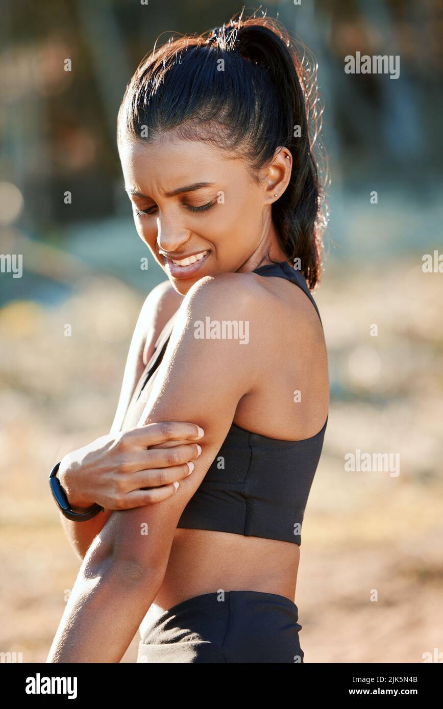 Its a struggle building muscle. a young woman experiencing muscle pain ...
