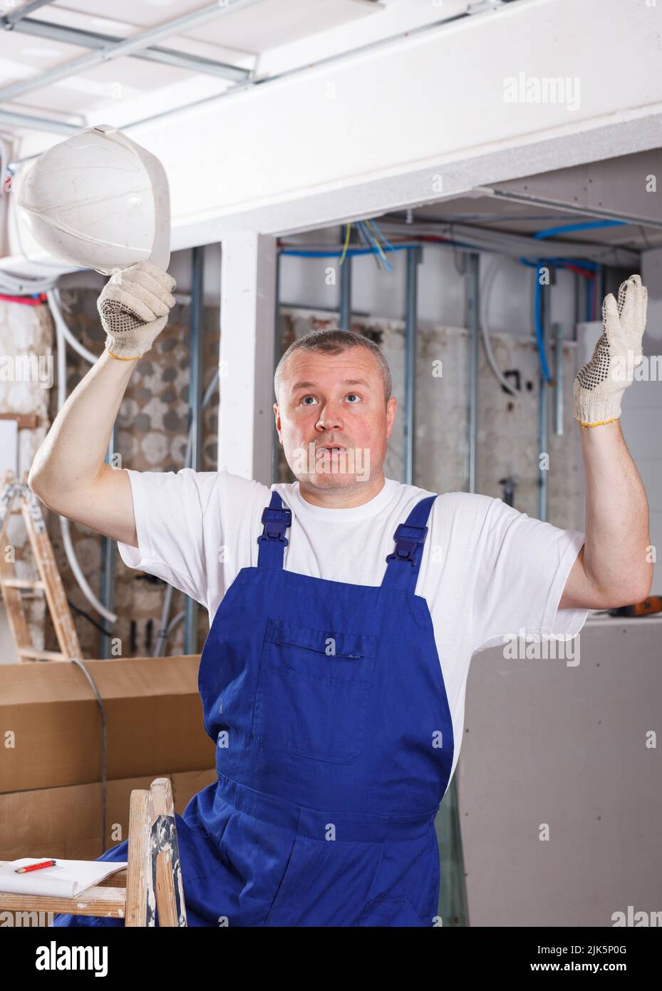 Confused puzzled construction builder worker hi-res stock photography ...