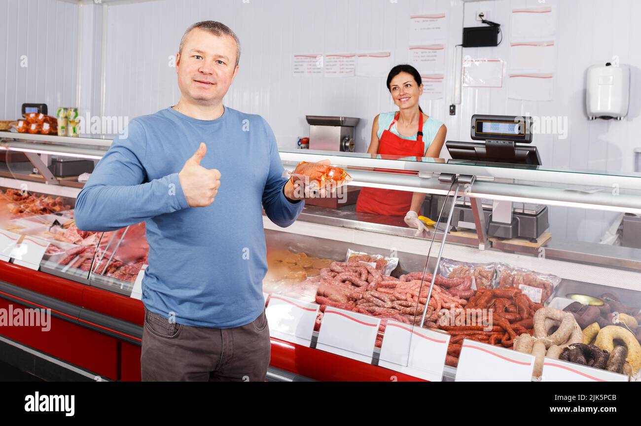male customer posing in butcher’s shop Stock Photo - Alamy