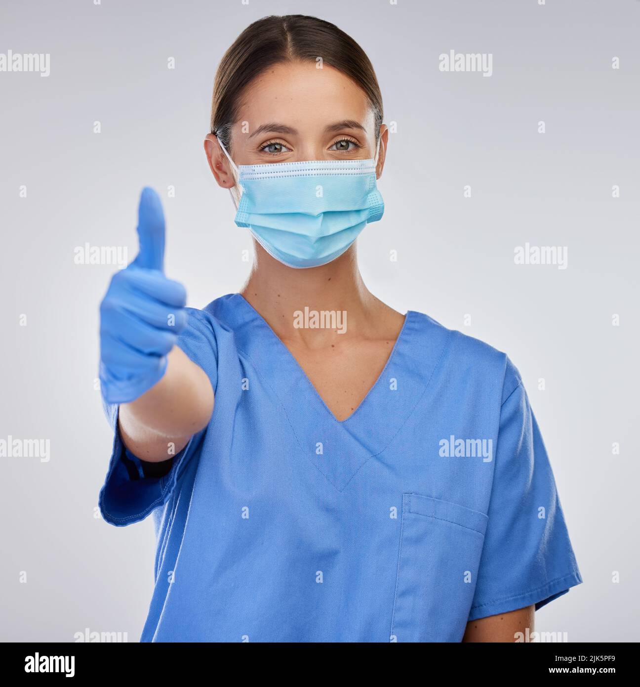 Youre doing a great job. a young female nurse giving the thumbs up ...
