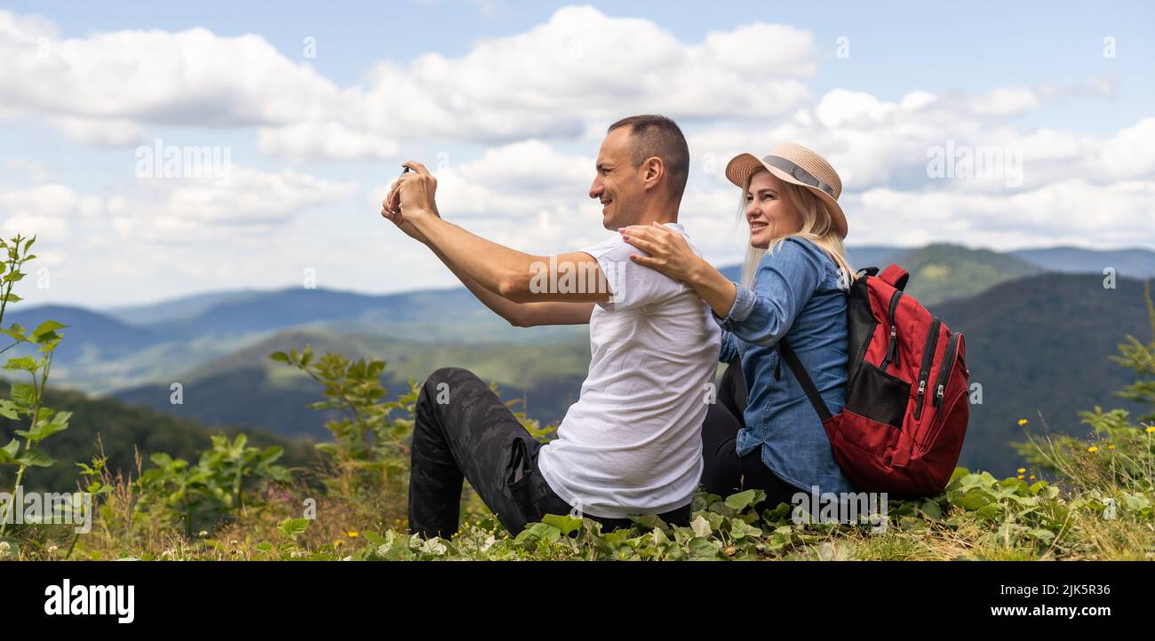 beautiful young couple enjoying nature at mountain Stock Photo - Alamy