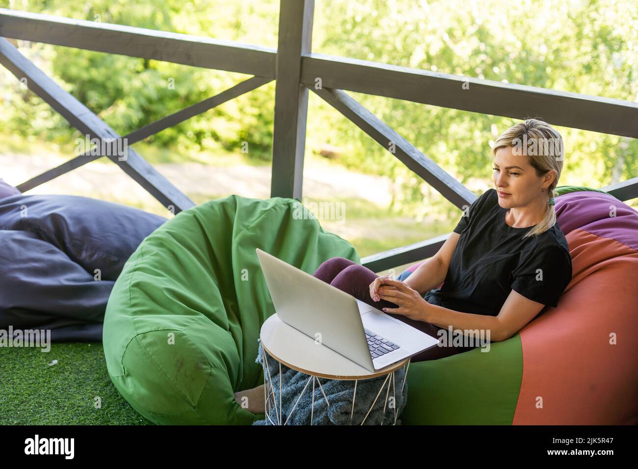 Work from home or study online, concept with a woman working at laptop ...