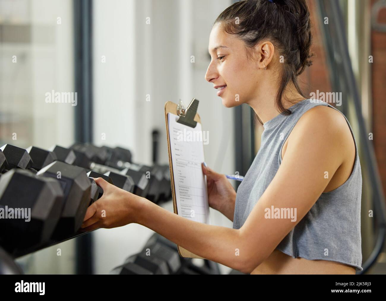 Our life is frittered away by detail...Simplify. a young woman checking ...