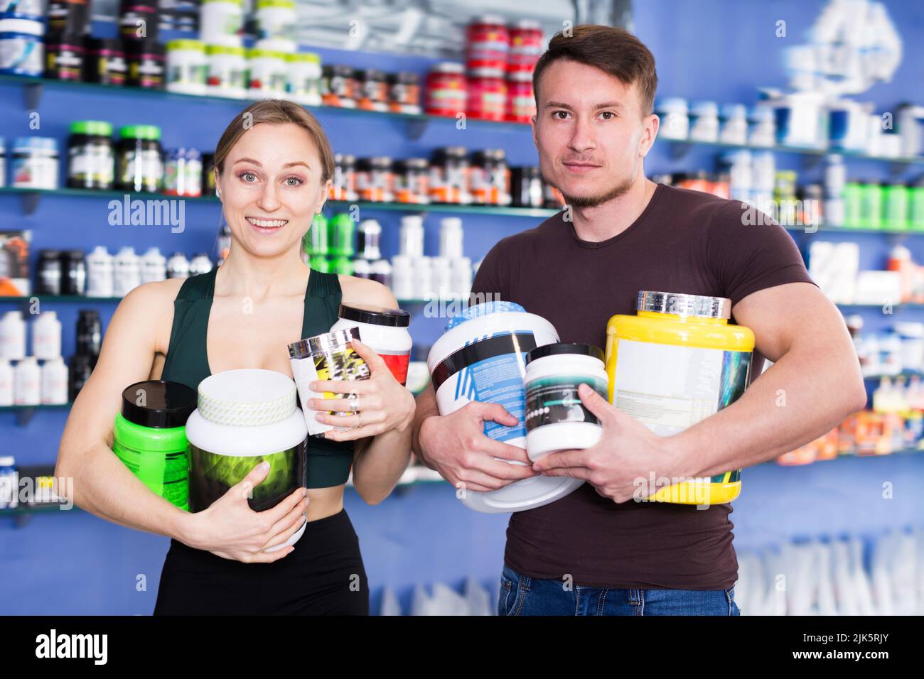 Ordinary people discussing in shop interior Stock Photo - Alamy