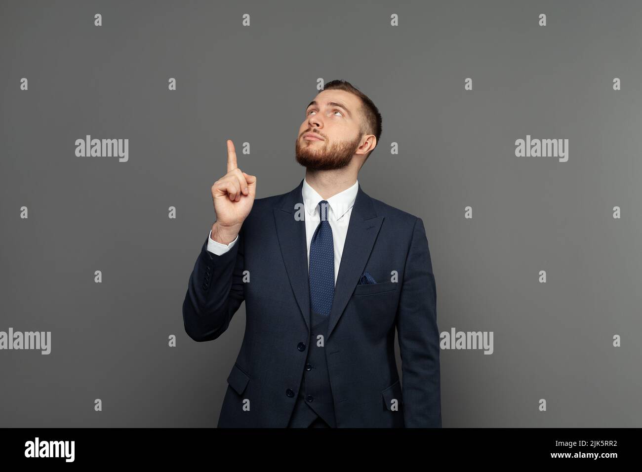 Handsome man pointing up against hi-res stock photography and images ...