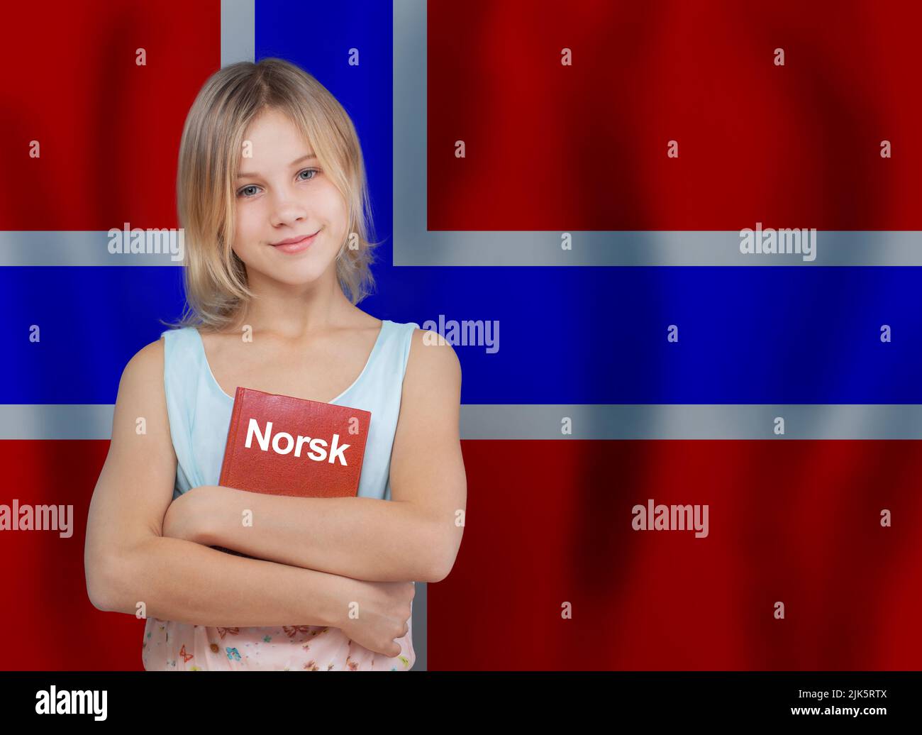Cute little girl with textbook with inscription Norwegian in Norwegian ...