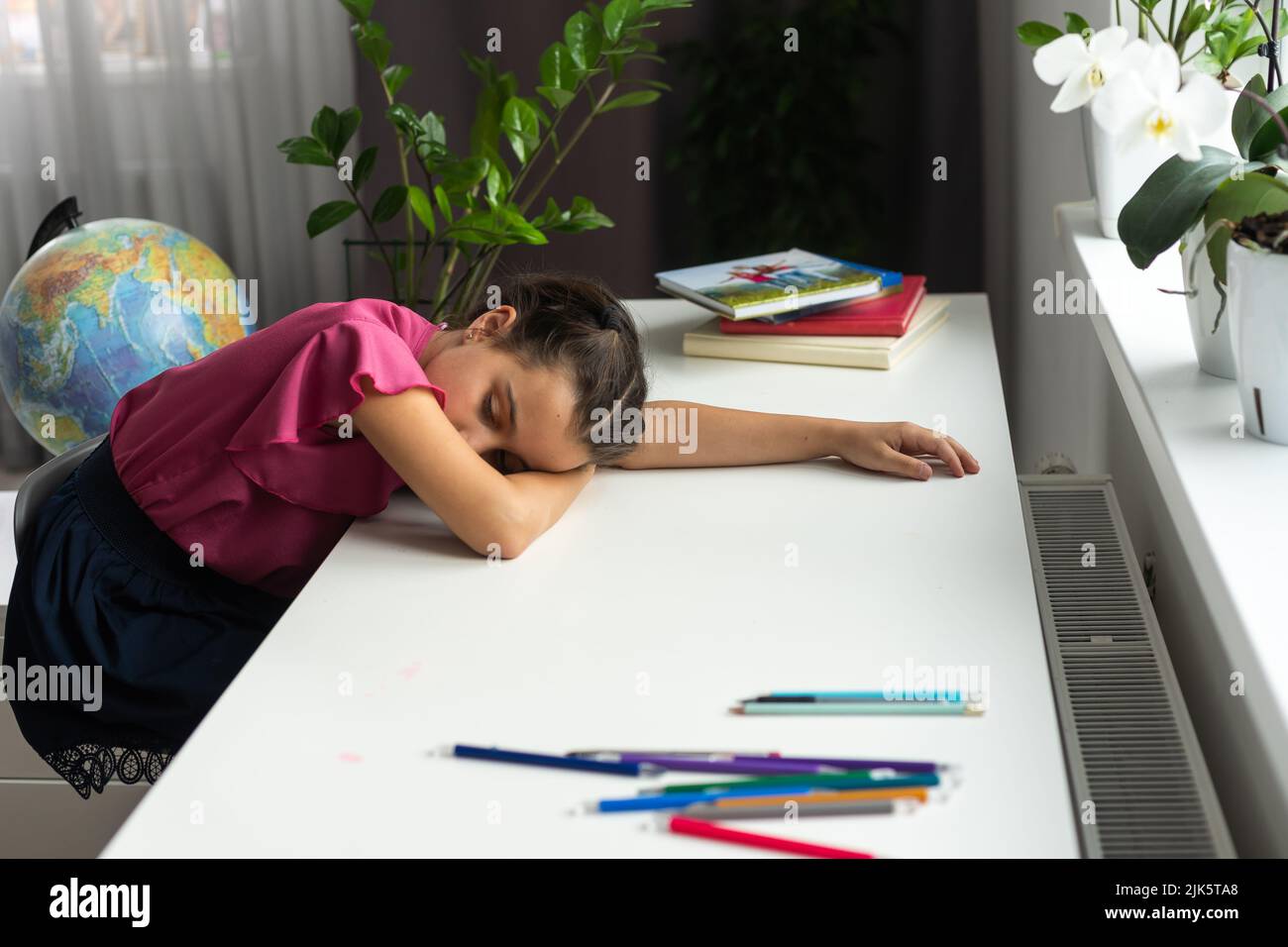 Sleepy student doing homework, kid is tired Stock Photo - Alamy