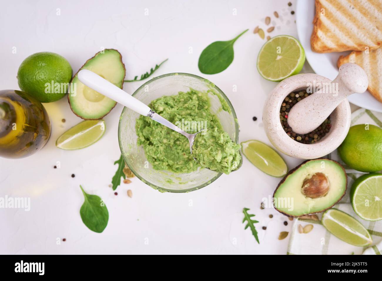 Toasts preparation - Mashed avocados in a glass bowl Stock Photo - Alamy