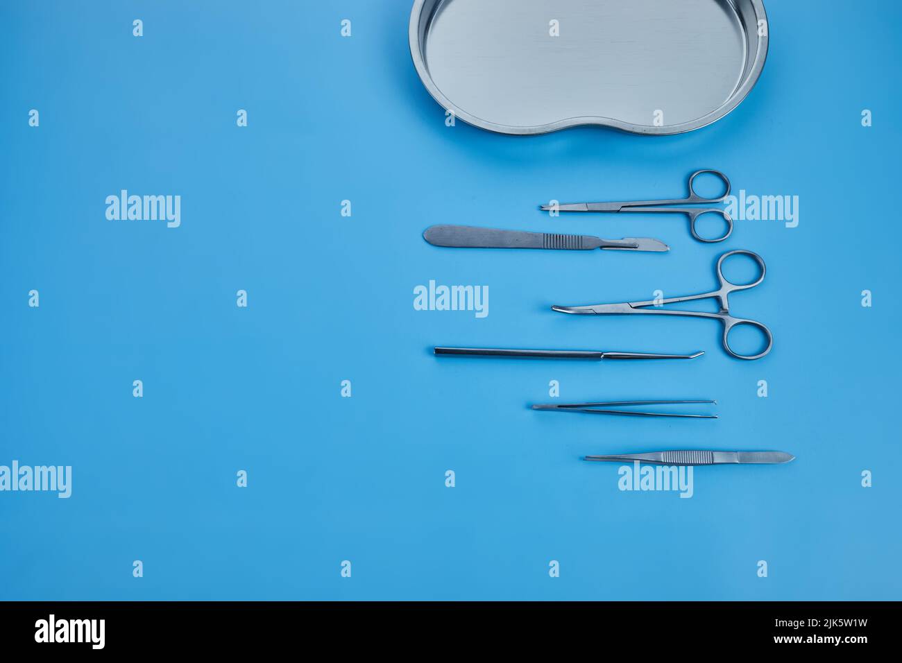 surgical equipment at surgery desk. Medical tools such scissors ...