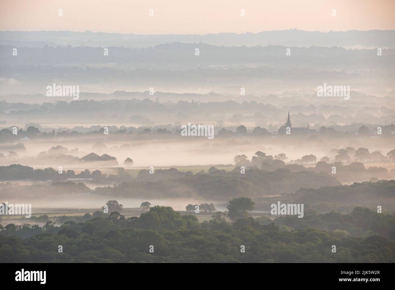 Stunning landscape image of layers of mist rolling over South Downs ...