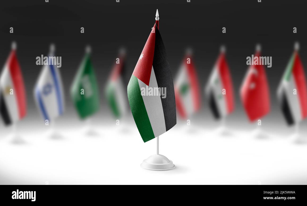 The national flag of the Jordan on the background of flags of other ...