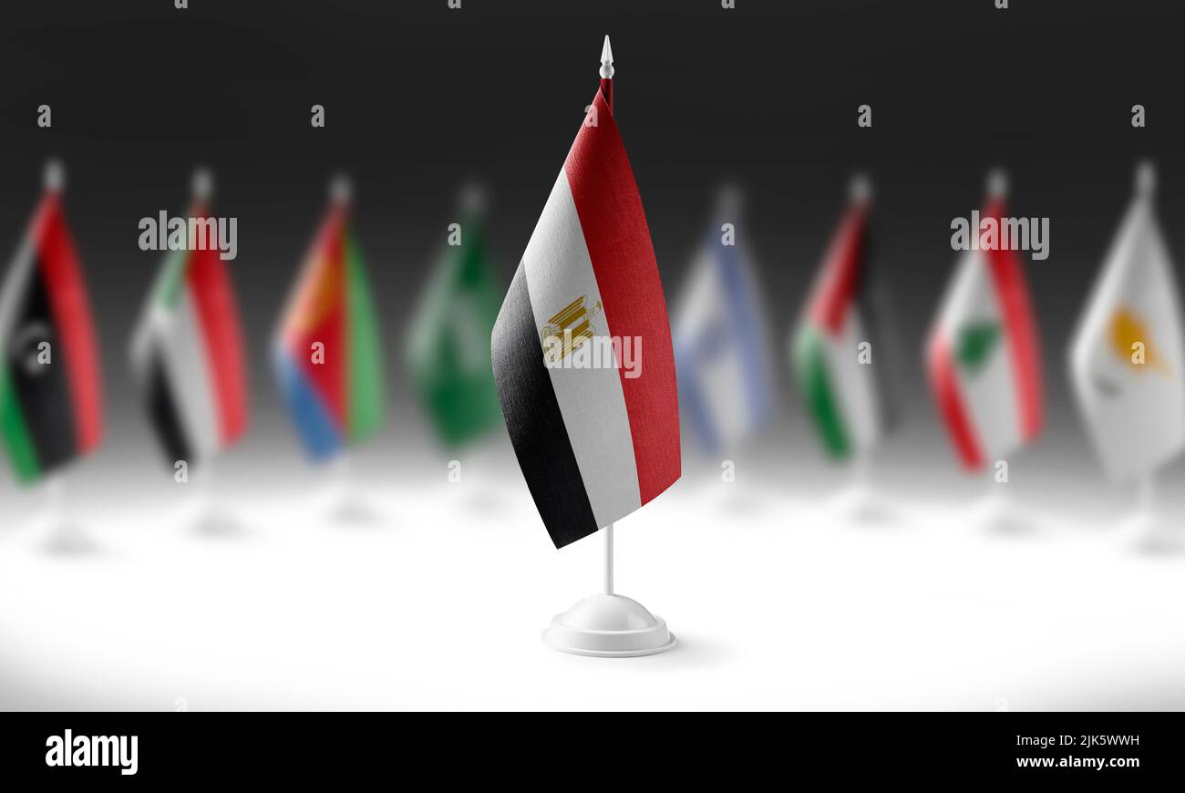 The national flag of the Egypt on the background of flags of other ...
