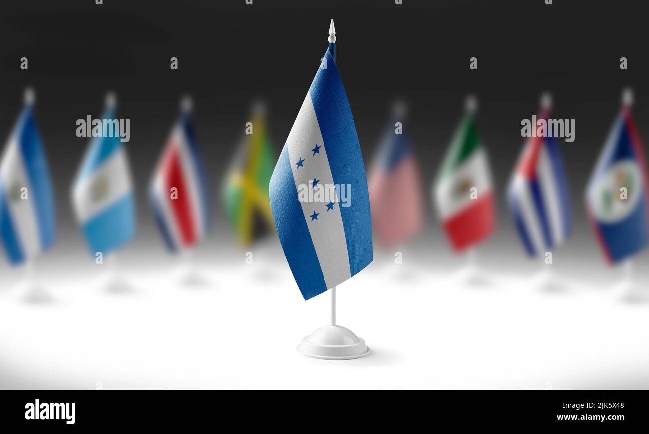 The national flag of the Honduras on the background of flags of other ...