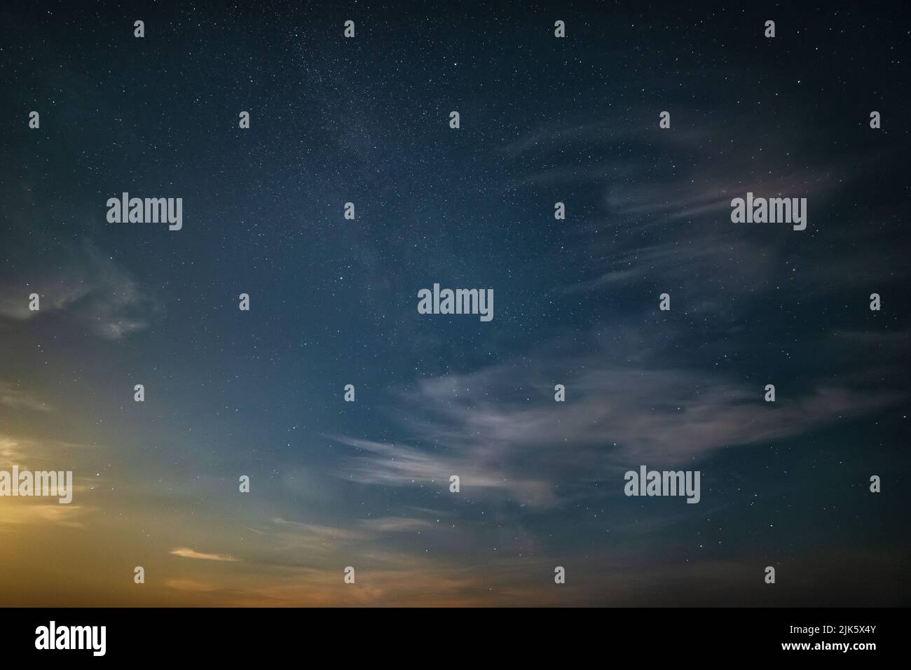 Beautiful noctilucent cloud formations against Milky Way background ...