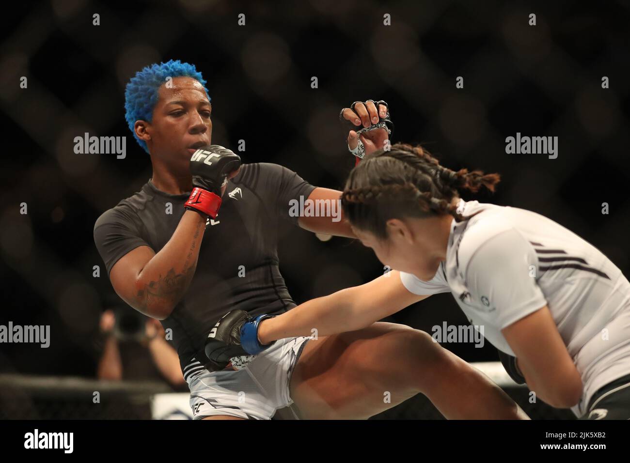 DALLAS, TX - JULY 30: (L-R) Joselyne Edwards kicks Ji Yeon Kim in their ...
