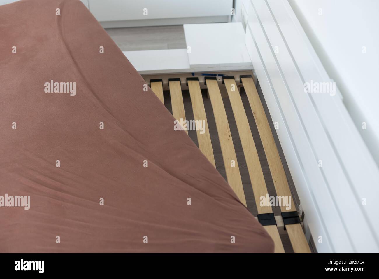 Disassembled sleeping bed. Renovation work in the room Stock Photo - Alamy