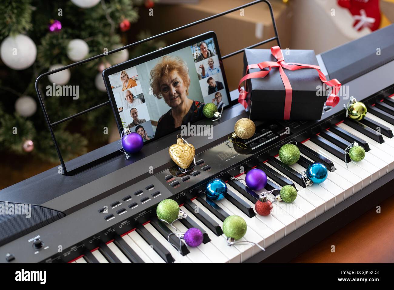 Black and white piano keys and tablet screen. The concept of online ...