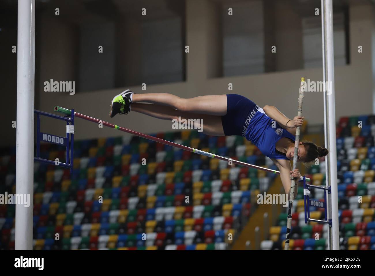 ISTANBUL, TURKEY - FEBRUARY 19, 2022: Undefined athlete pole vaulting ...