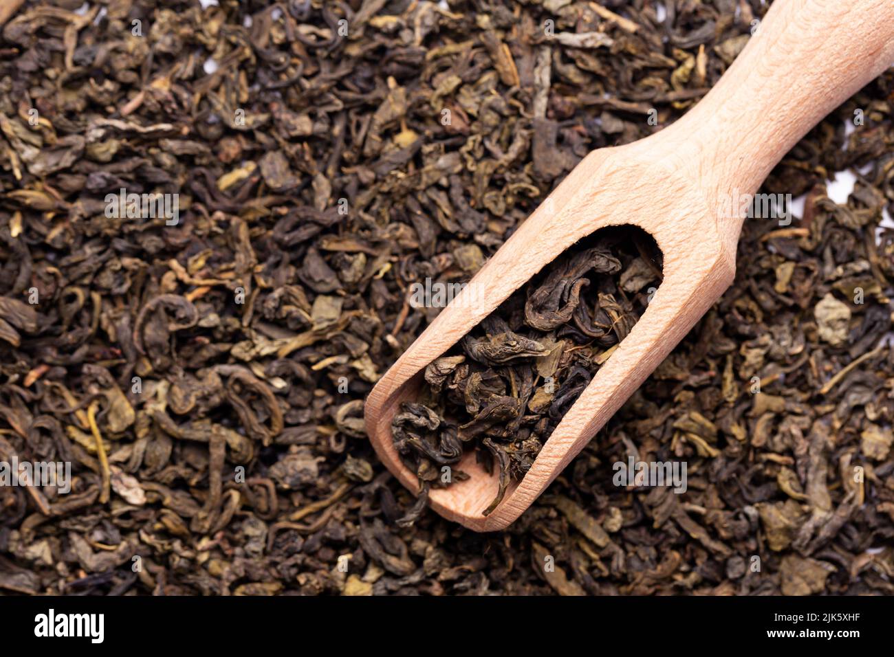 Dry green tea leaf on spoon texture background. Top view Stock Photo ...